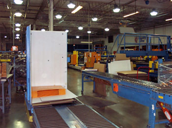 Manually stacking bundles of finished goods (typically flat corrugated ...